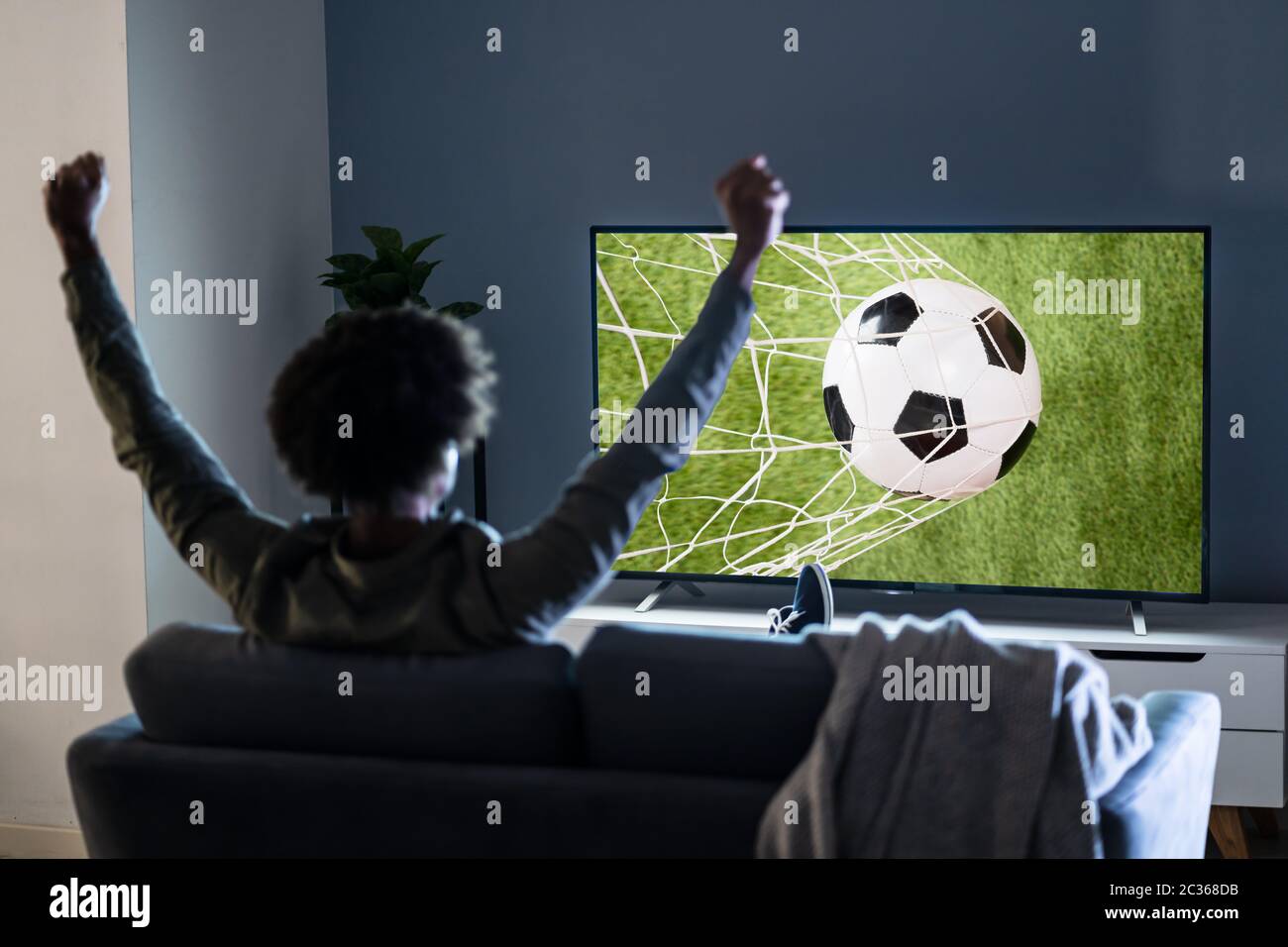 Portrait Of An Excited Man Watching Soccer Game On Television Stock ...