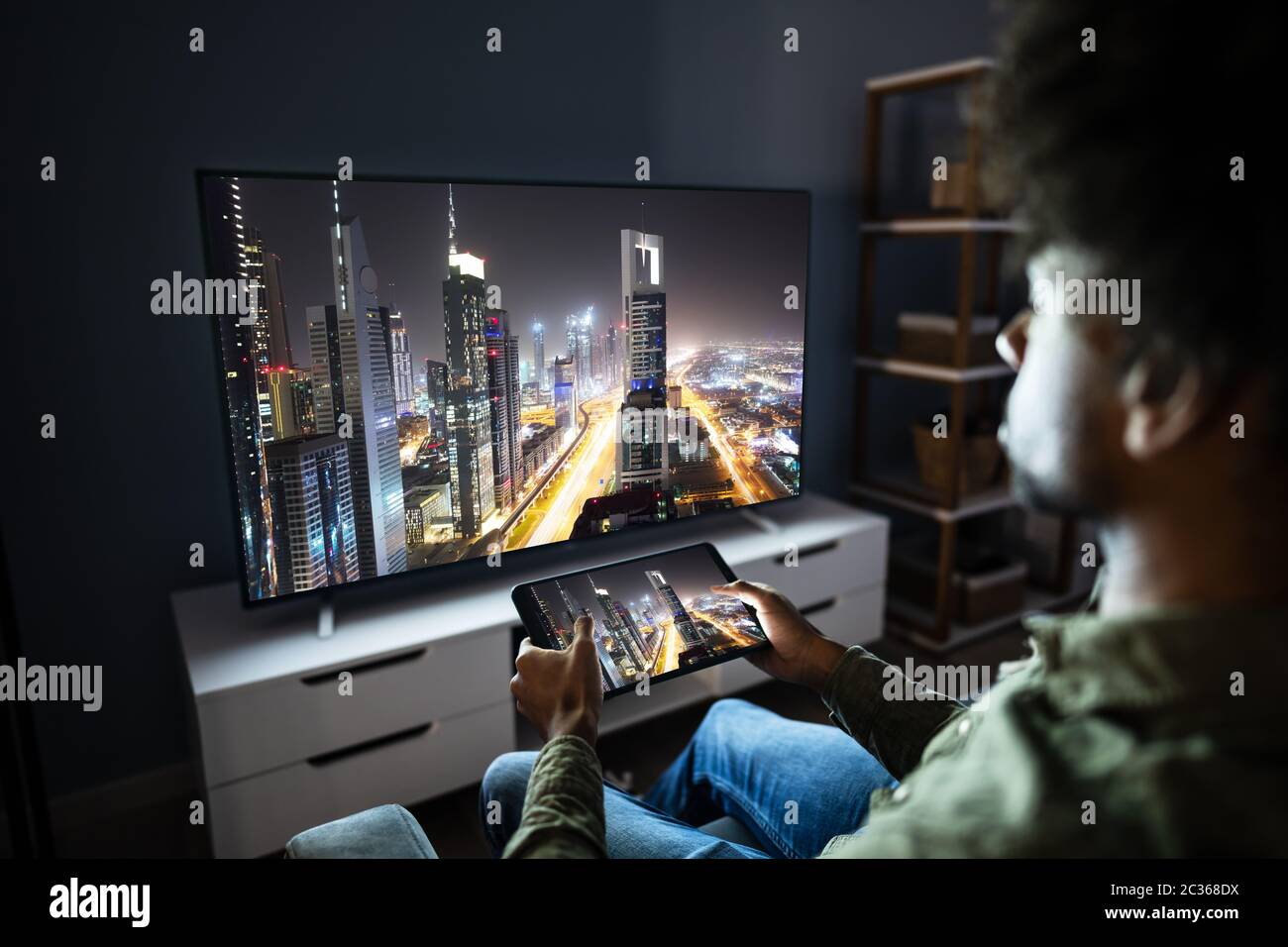 Man Connecting Television Channel Through Wireless On Digital Tablet At ...