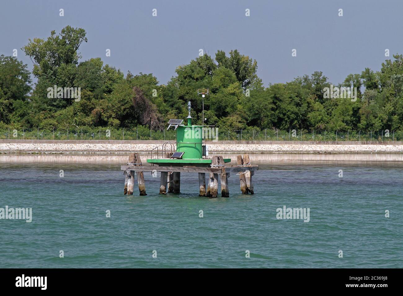 Small Green Lighthouse in Harbour Channel Near Venice Stock Photo - Alamy