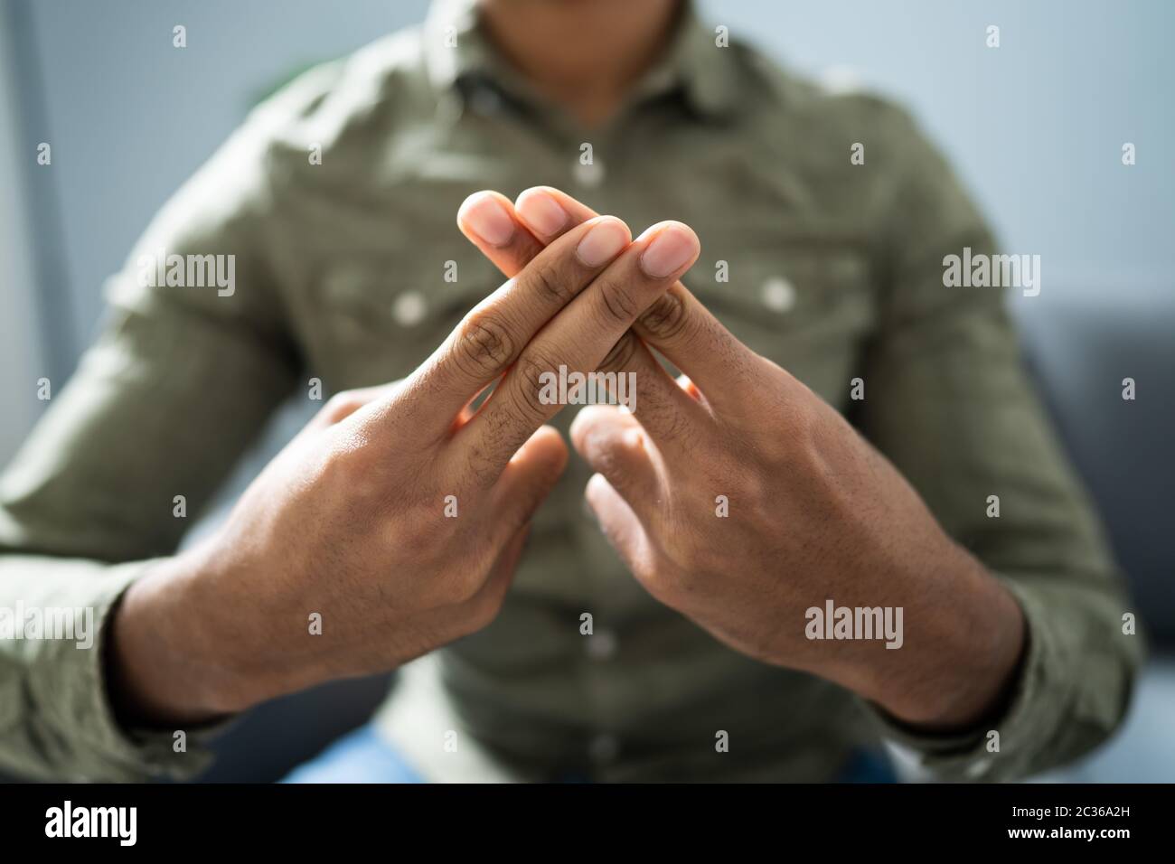 Man Using Sign Language To Communicate At Home Stock Photo - Alamy