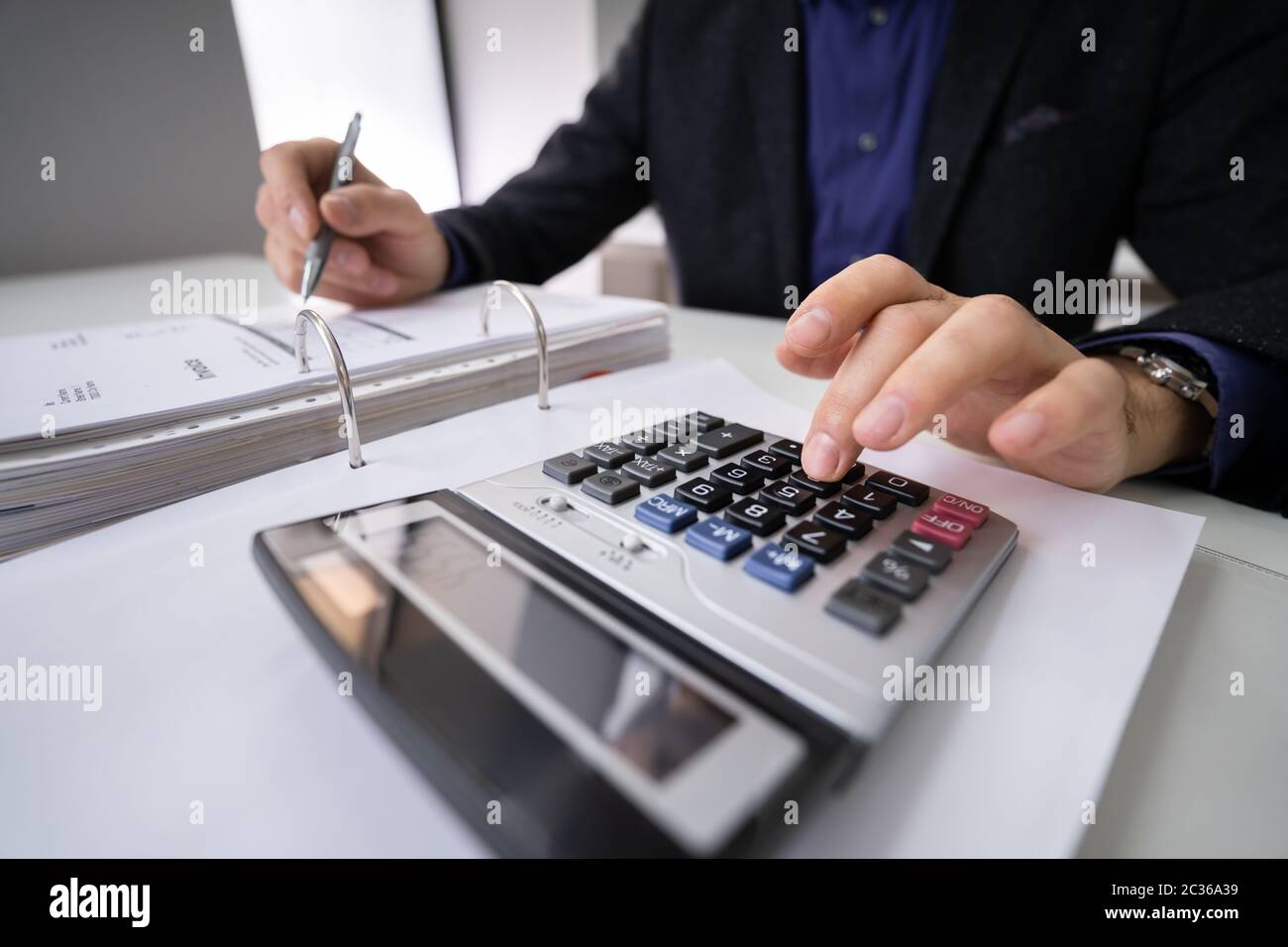 Midsection businessman using calculator hi-res stock photography and ...