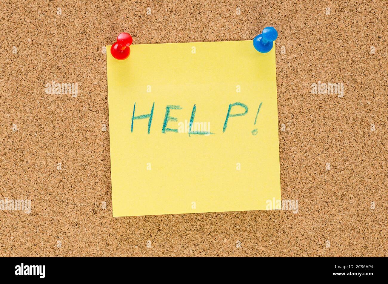 Help note pinned to corkboard background Stock Photo - Alamy