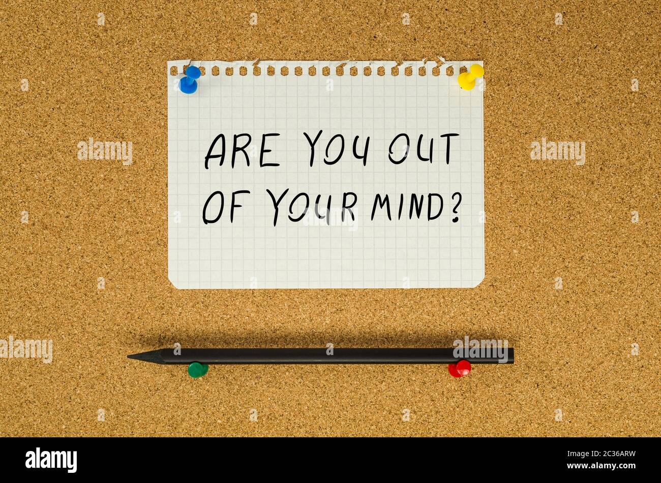 Are you out of your mind text note message pin on bulletin board Stock ...