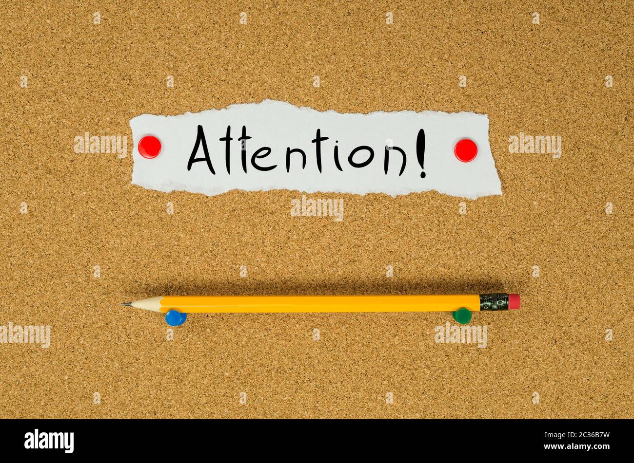 Attention text note message pin on bulletin board Stock Photo - Alamy