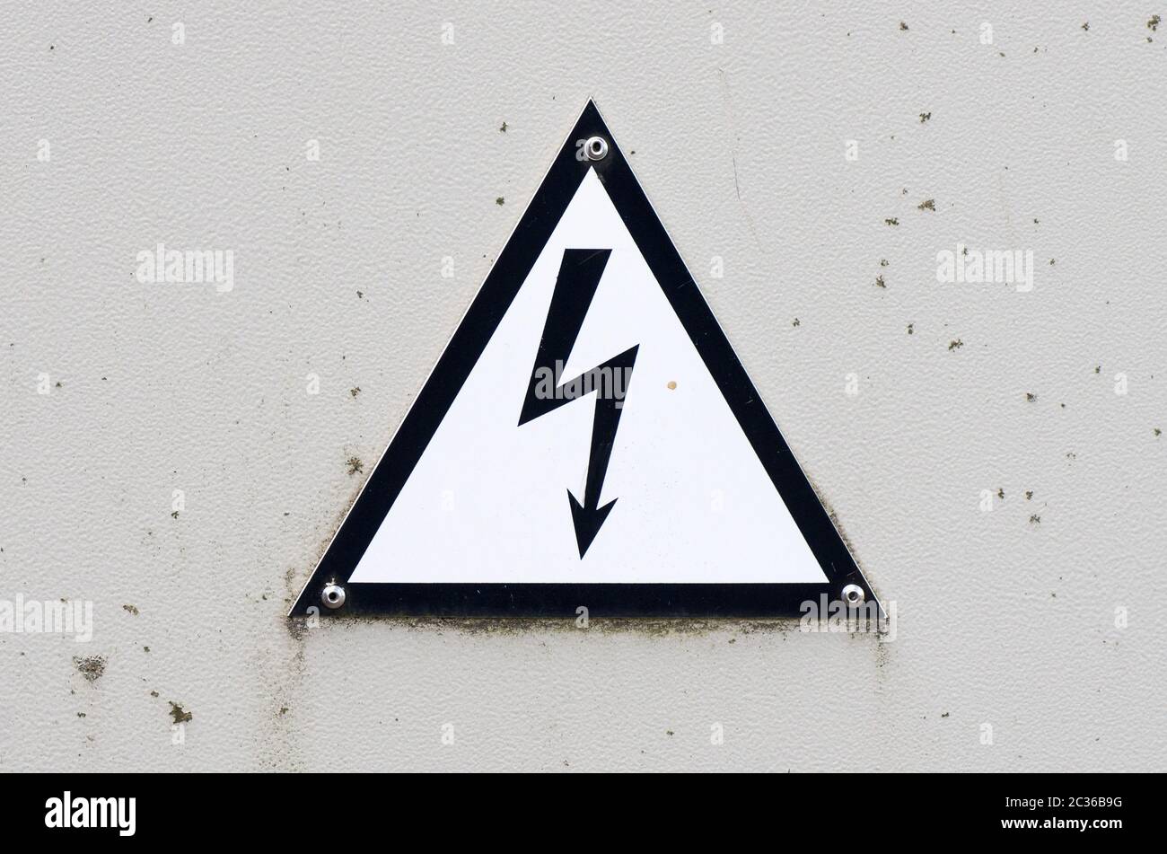 Old and dirty high voltage sign on white metal plate Stock Photo - Alamy