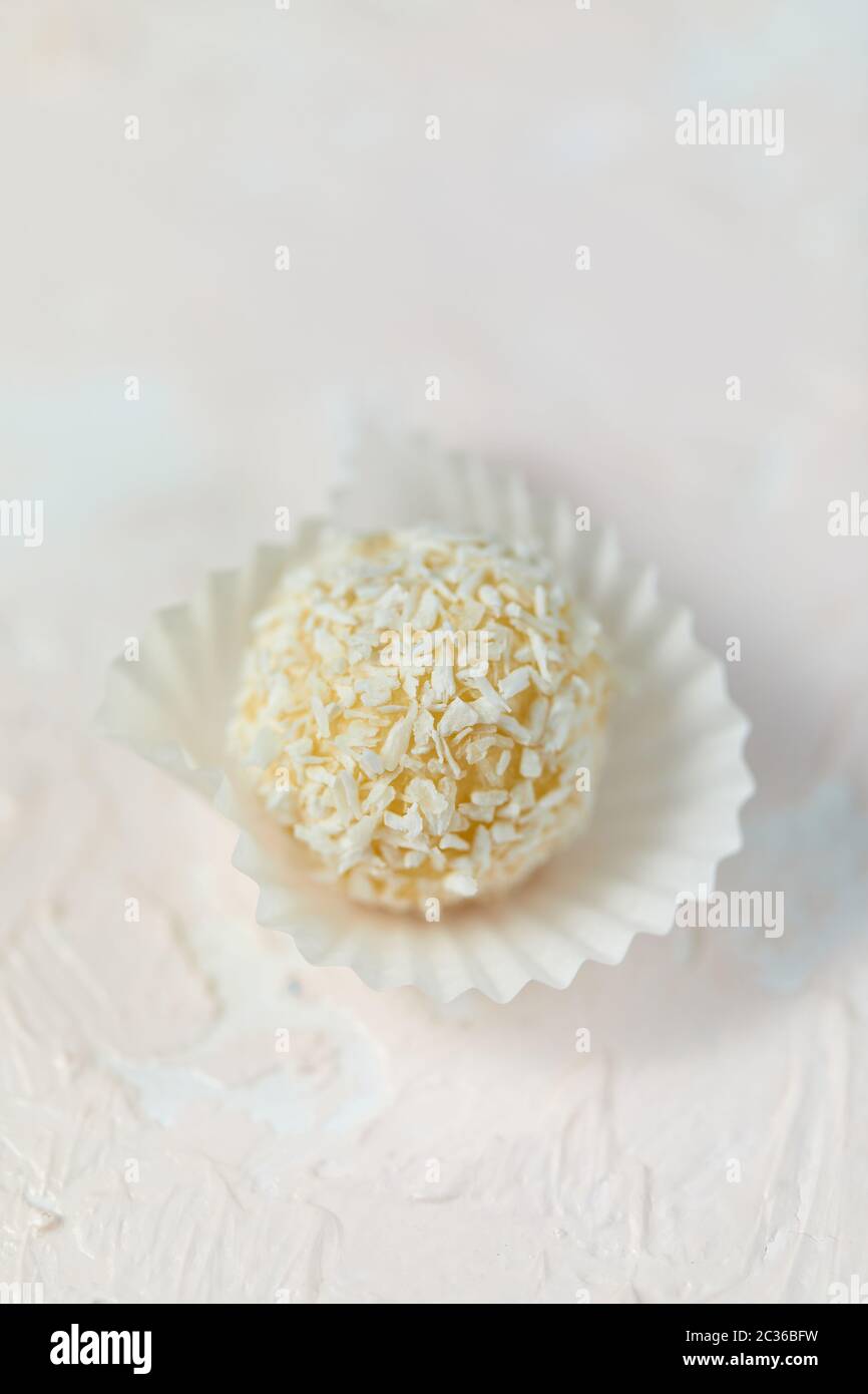 Candies covered by shredded coconut. coconut balls with coconut flakes ...