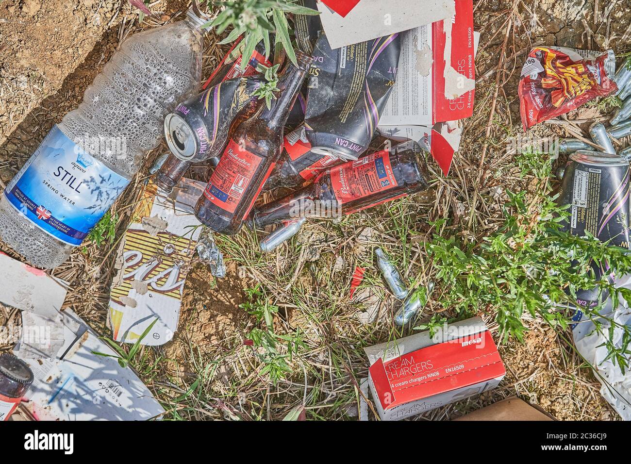 Leftovers in a field from a drinking and drugs session Stock Photo - Alamy