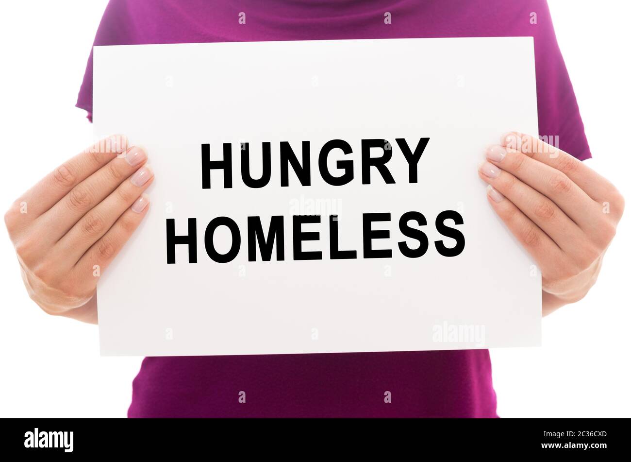 Girl holding white paper sheet with text Hungry homeless Stock Photo ...