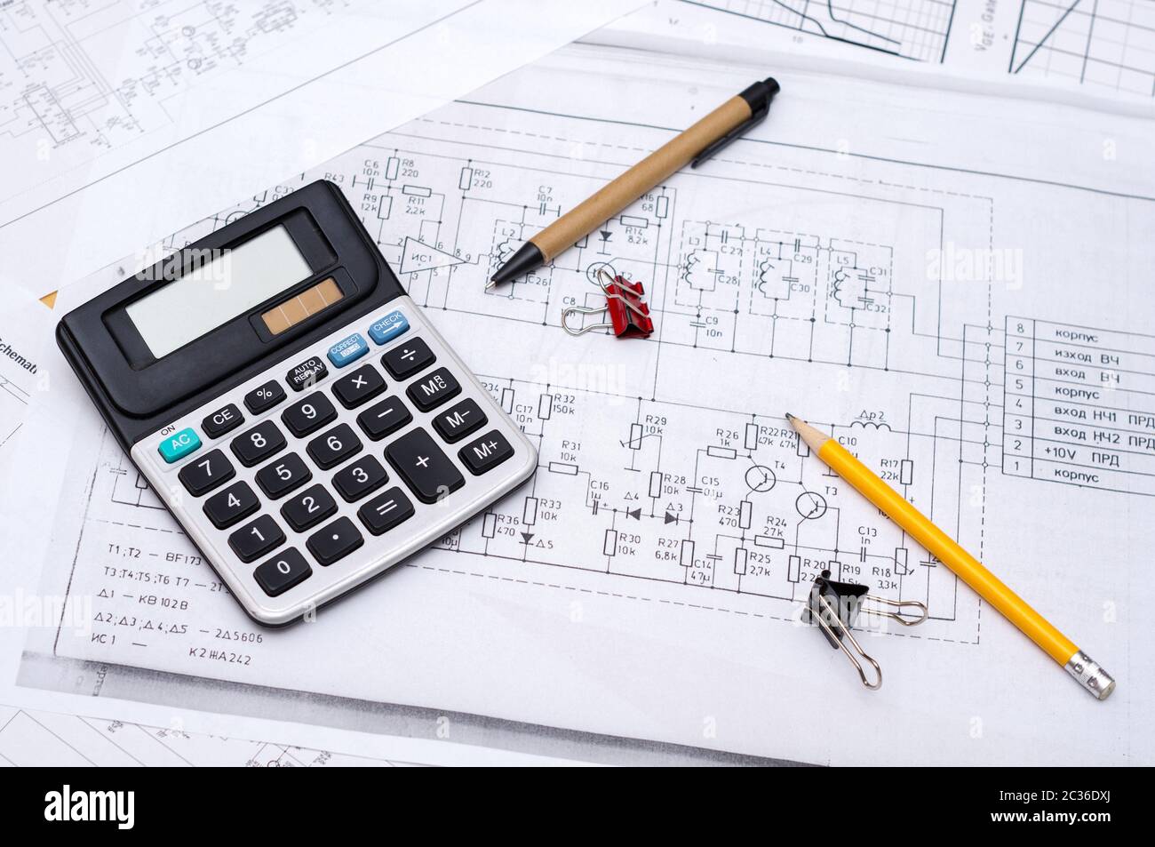 Electrical drawings with calculator, pencils and paper clips Stock ...