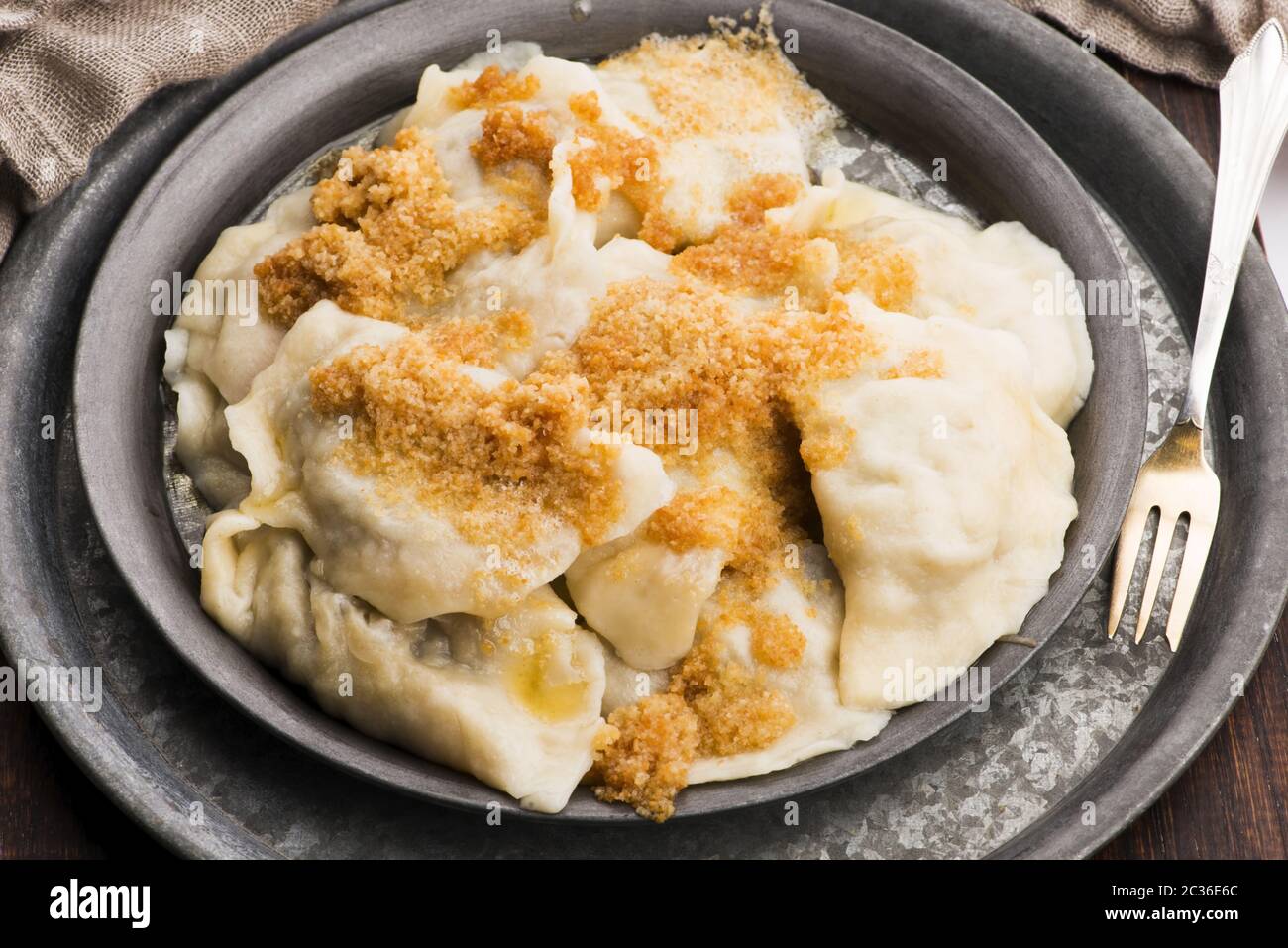 Boiled pierogi (Polish dumplings) stuffed with cabbage and mushrooms ...