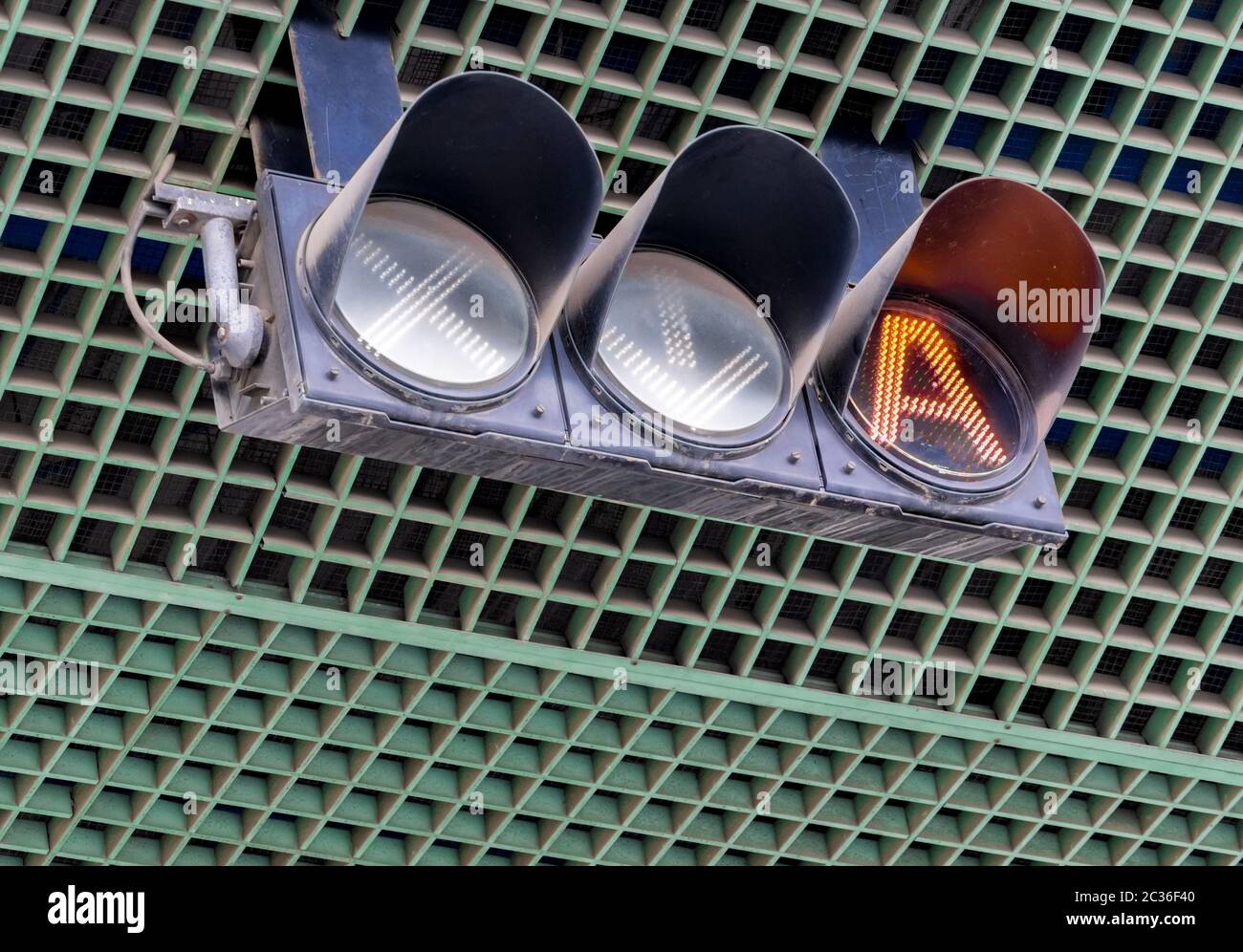 Traffic signal light at tollgate of tollway. Orange color "A" symbol in ...
