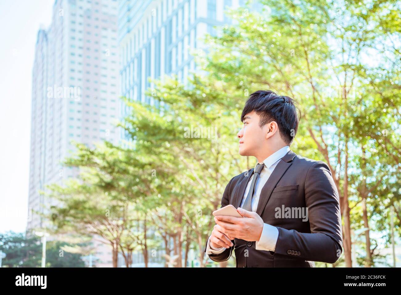 Handsome asian businessman using smart hi-res stock photography and ...