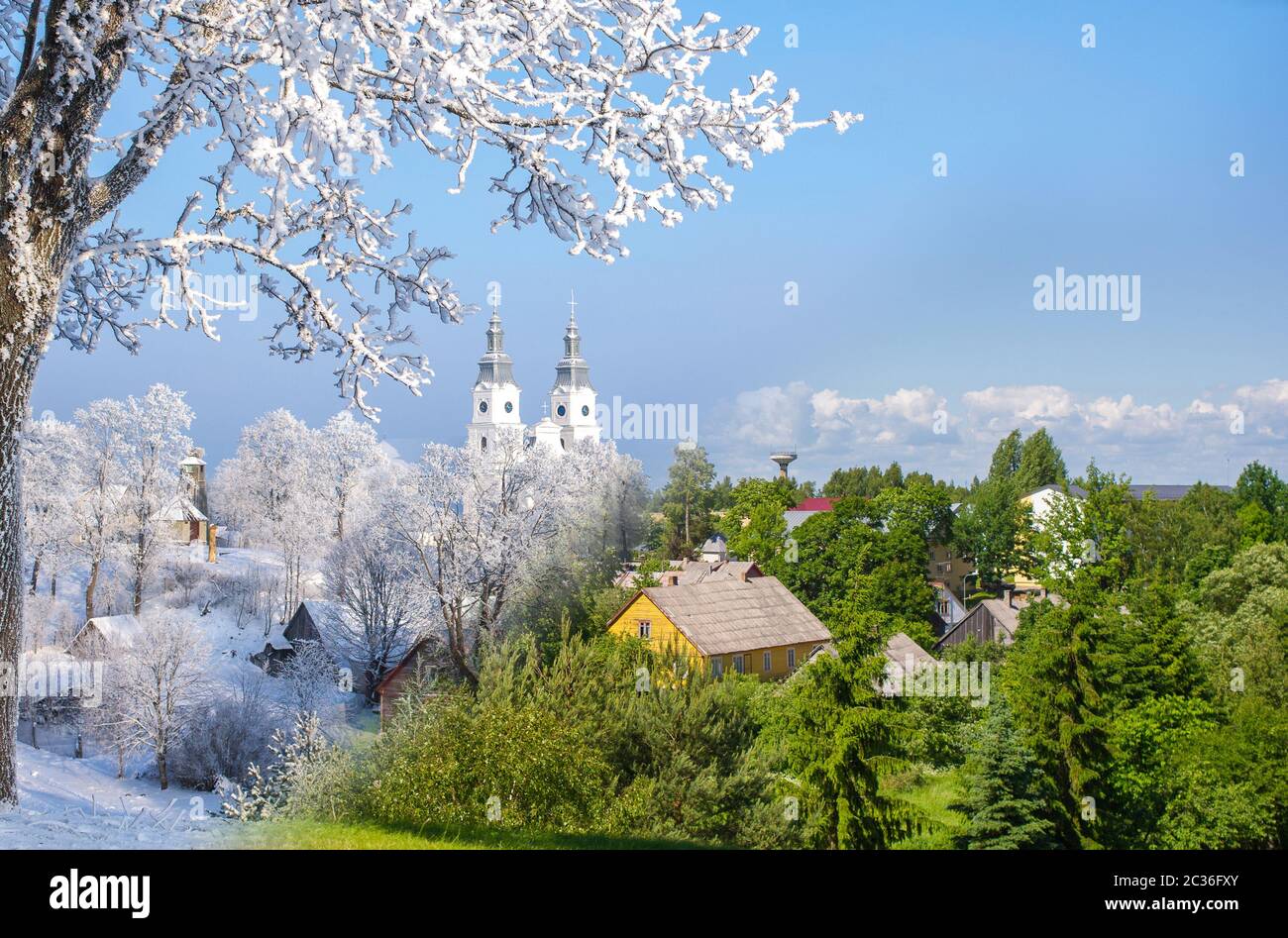 Cold winter and hot summer in one photo. Lithuania, Zemaiciu Kalvarija ...
