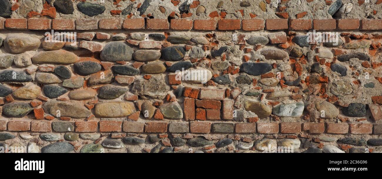 ancient brick and stone wall useful as a background Stock Photo - Alamy