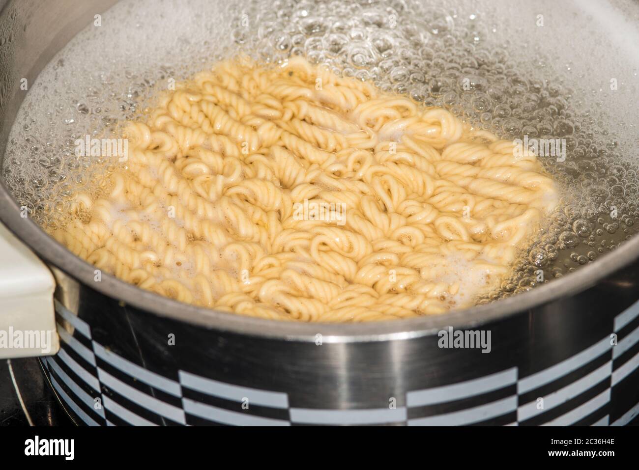 noodles cooking in a pot Stock Photo - Alamy