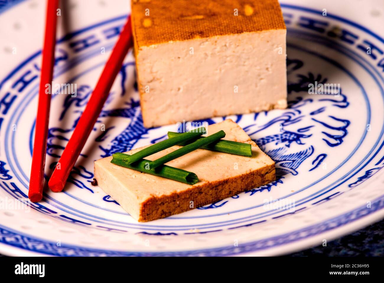 Tofu, closeup of a smoked piece Stock Photo - Alamy