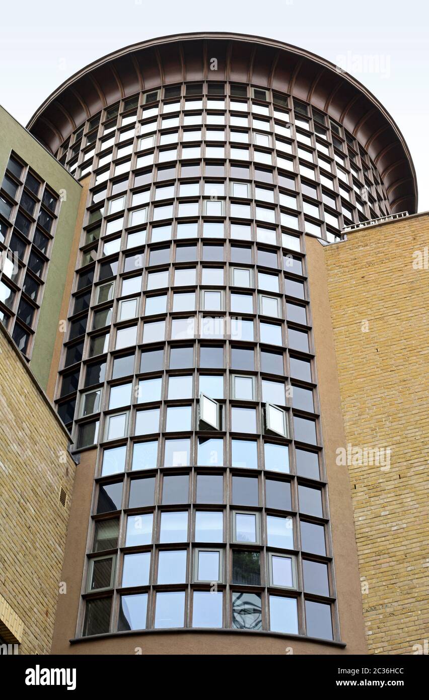 Building exterior with oval glass windows facade Stock Photo - Alamy