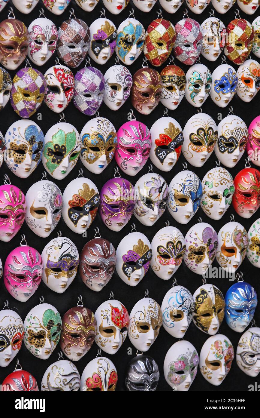 Bunch of small colourful Venetian masks decor Stock Photo - Alamy