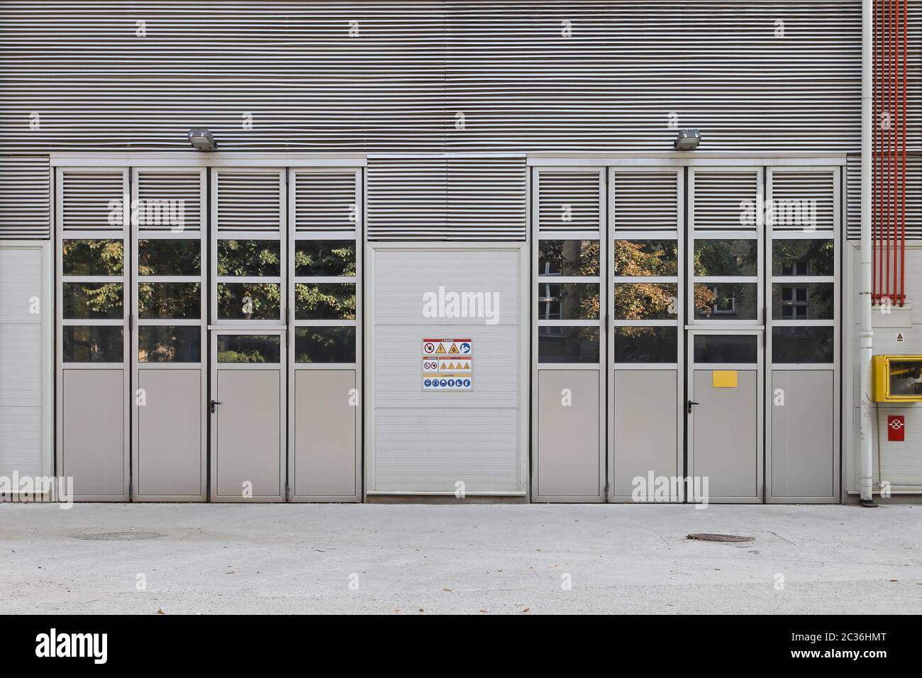 Big industrial double doors at metal factory Stock Photo - Alamy