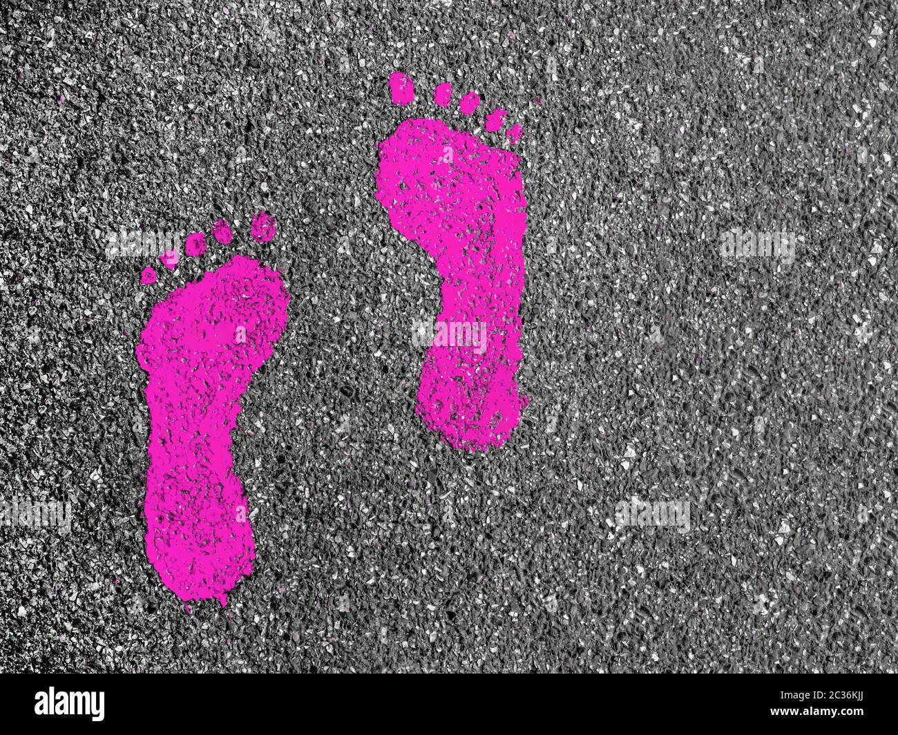 Pink footprints on asphalt Stock Photo - Alamy