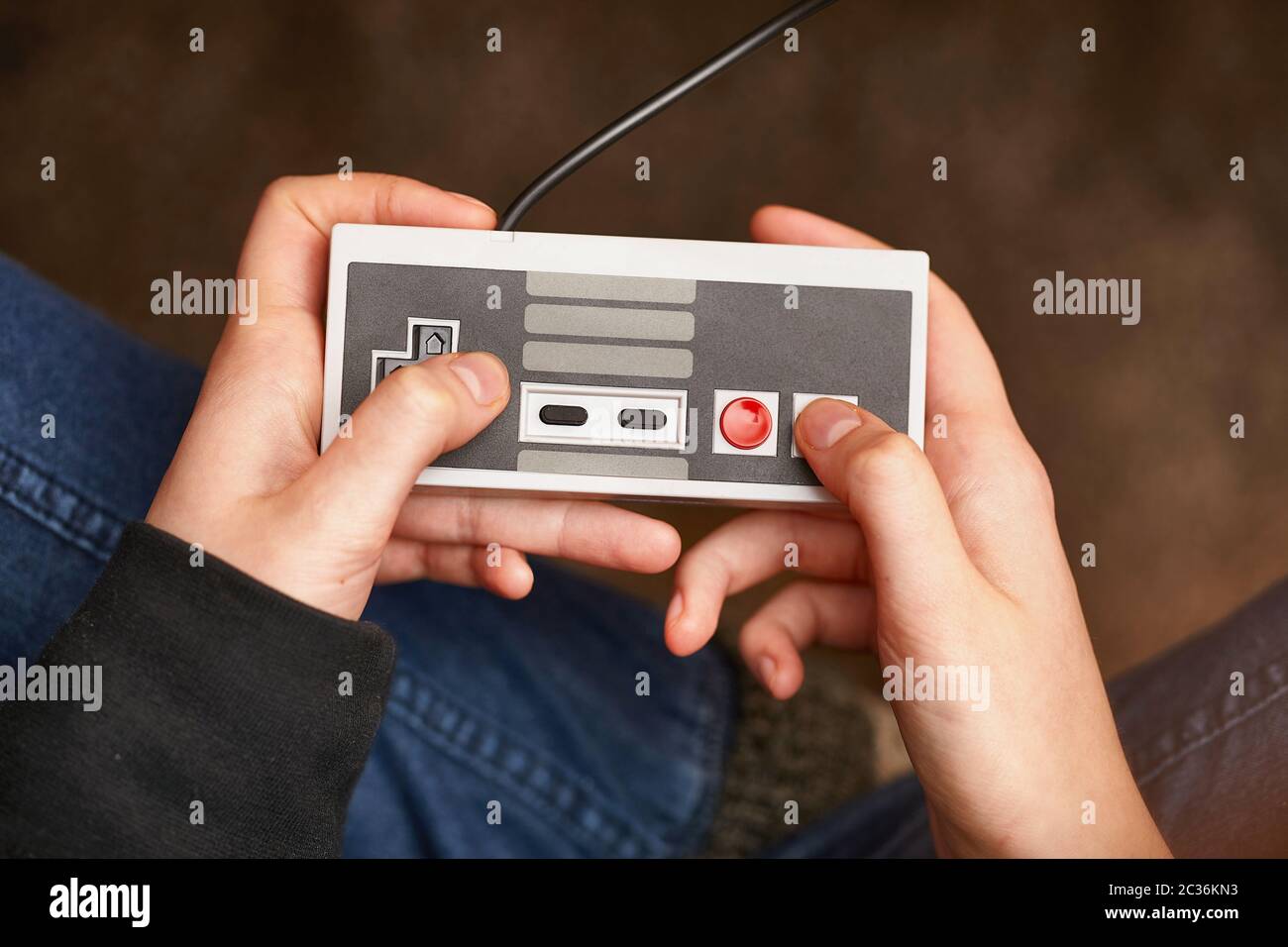Playing old video game console Stock Photo - Alamy
