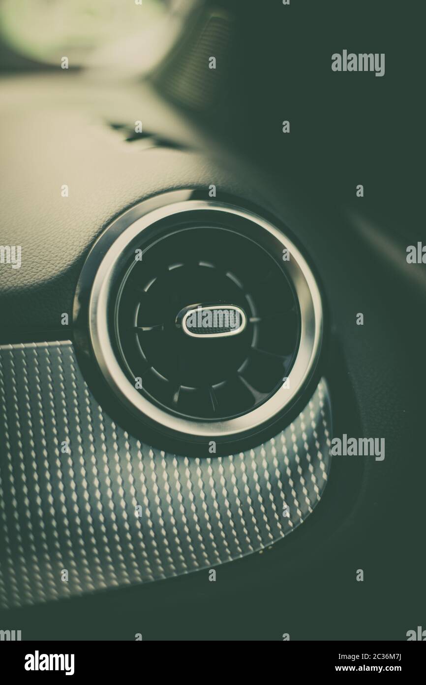 Detail of a round air vent inside a car Stock Photo - Alamy