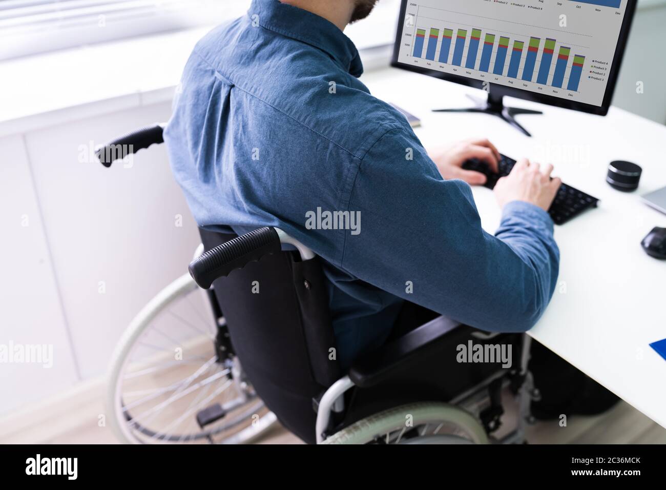 Handicapped Businessman Sitting On Wheelchair And Using Computer In ...