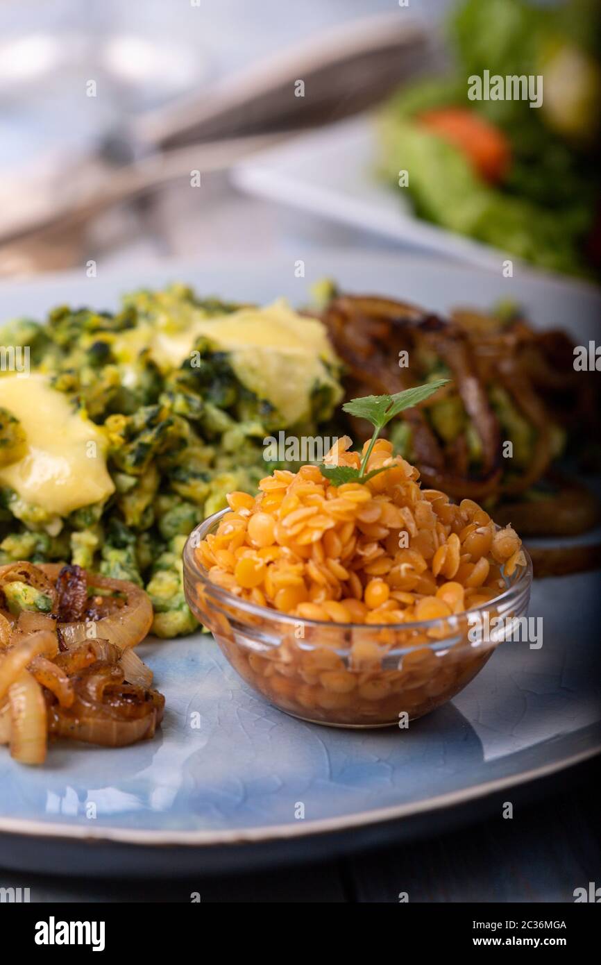 bavarian spinach spaetzle on a plate Stock Photo - Alamy