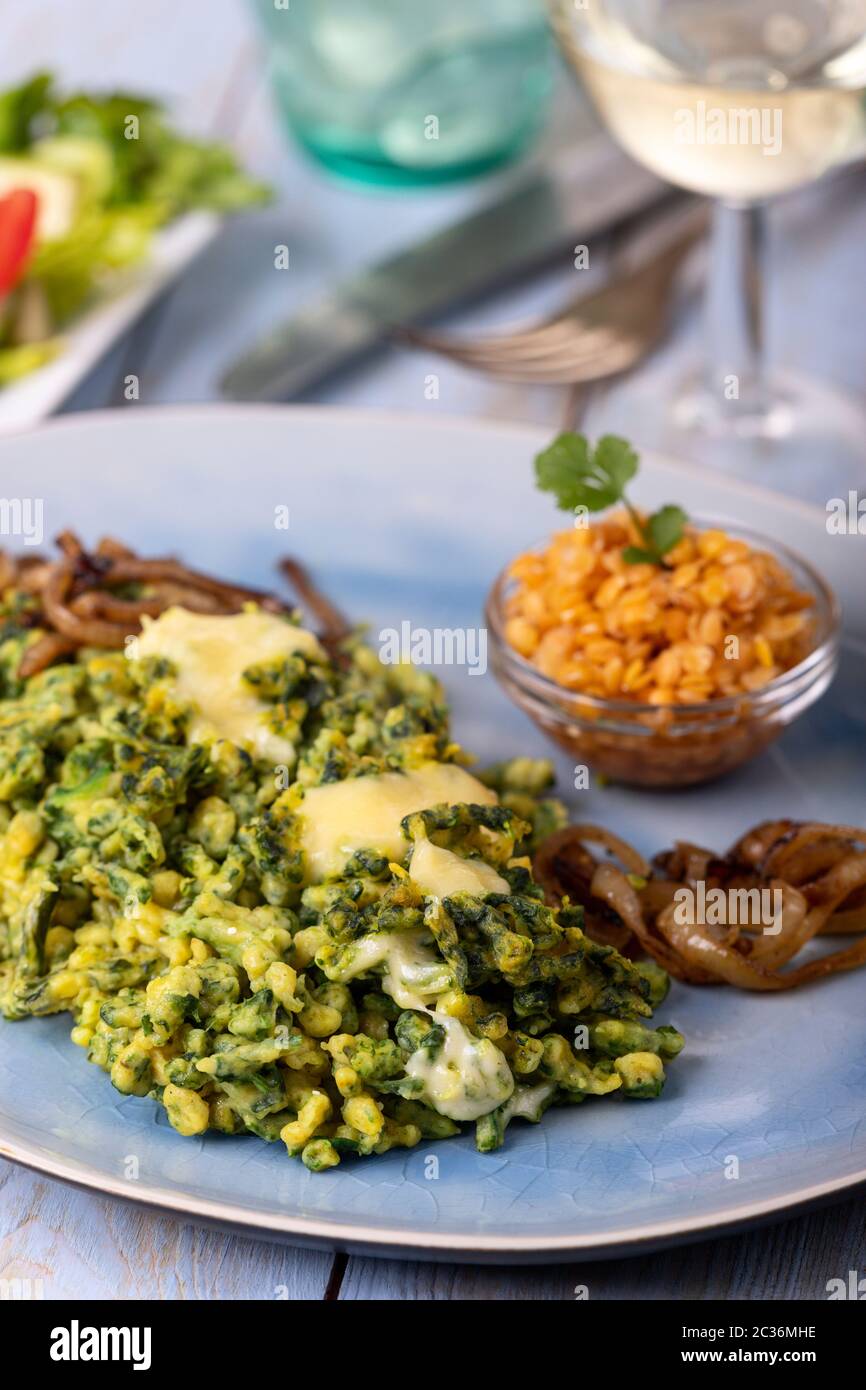 bavarian spinach spaetzle on a plate Stock Photo - Alamy