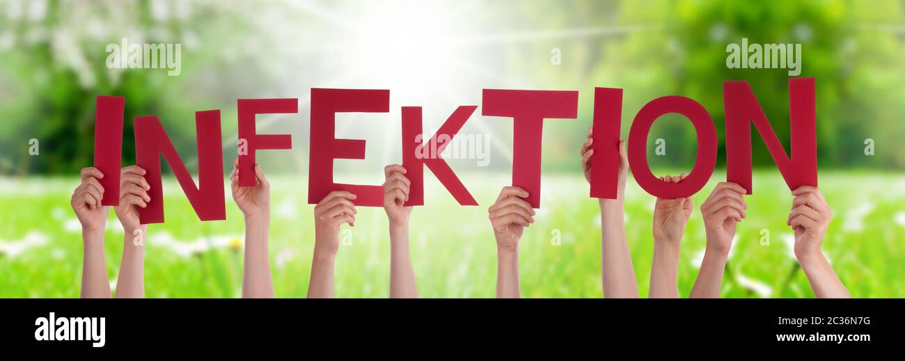 People Hands Holding Red German Word Infektion Means Infection. Sunny ...