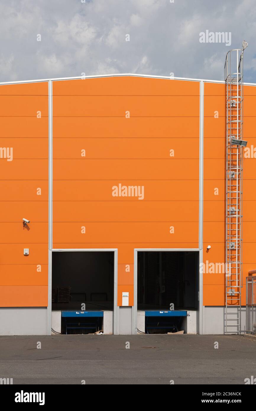 Two Cargo Doors at Orange Distribution Warehouse Stock Photo - Alamy
