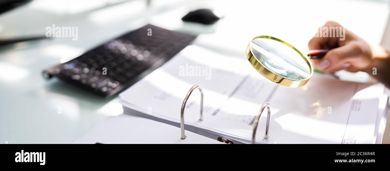 Auditor Investigating Corporate Fraud Using Magnifying Glass Stock ...