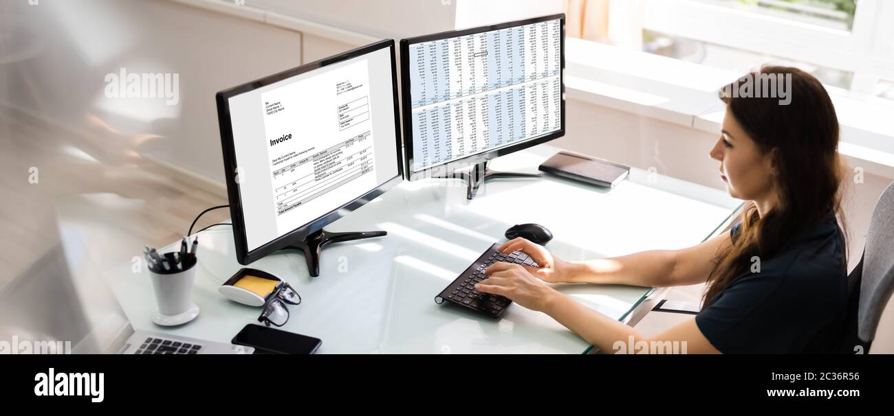 Accountant Using E Invoice Software At Computer In Office Stock Photo ...