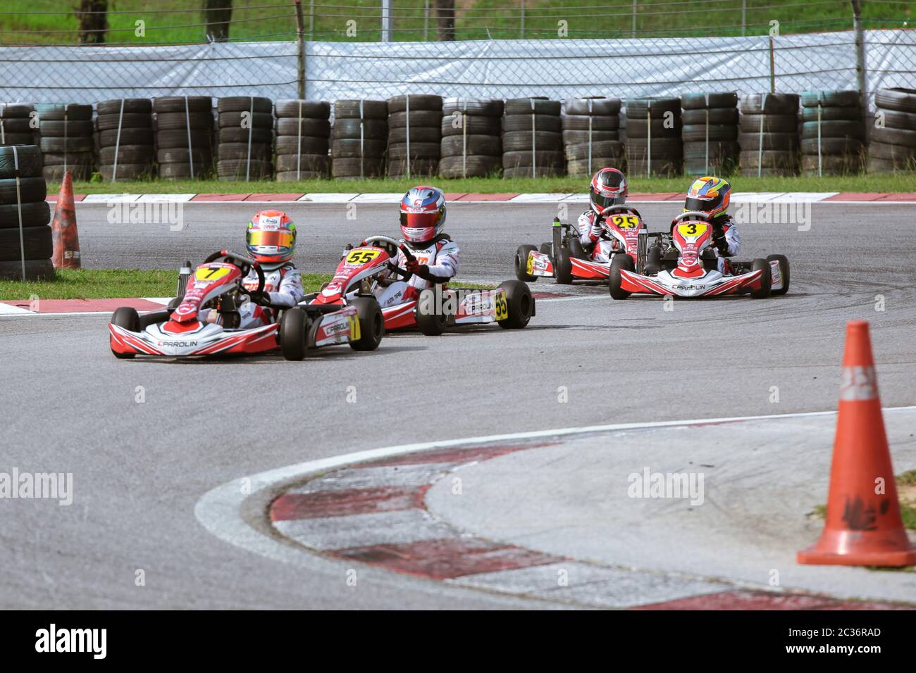 Kart racers navigating the corner on the race track Stock Photo - Alamy