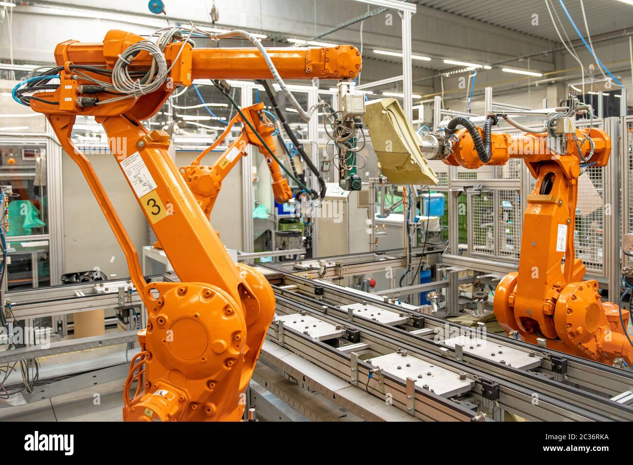 the use of robot arms in intelligent industrial factories Stock Photo ...