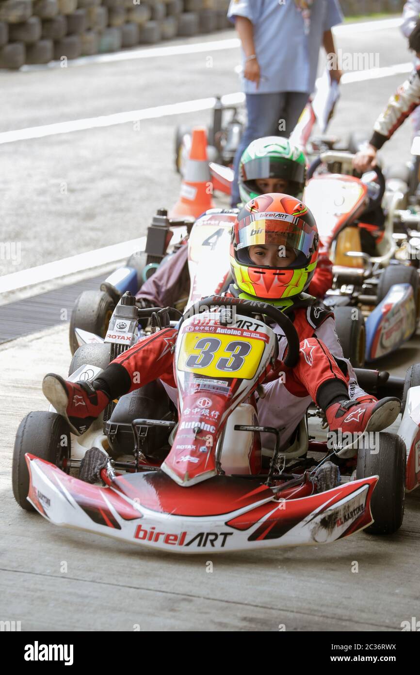 Kart racers getting ready for routine checkout procedure after a race ...