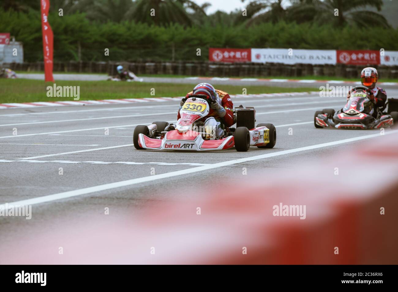 Kart racers competing on the race track Stock Photo - Alamy