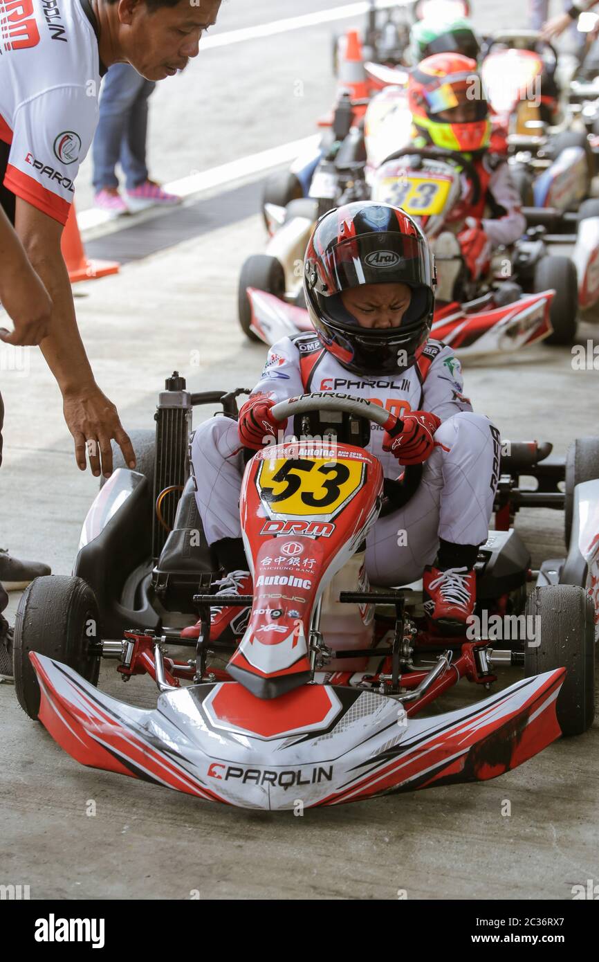 Kart racers getting ready for routine checkout procedure after a race ...