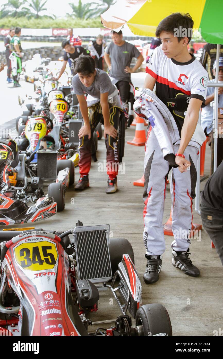 Kart racers getting ready for routine checkout procedure after a race ...