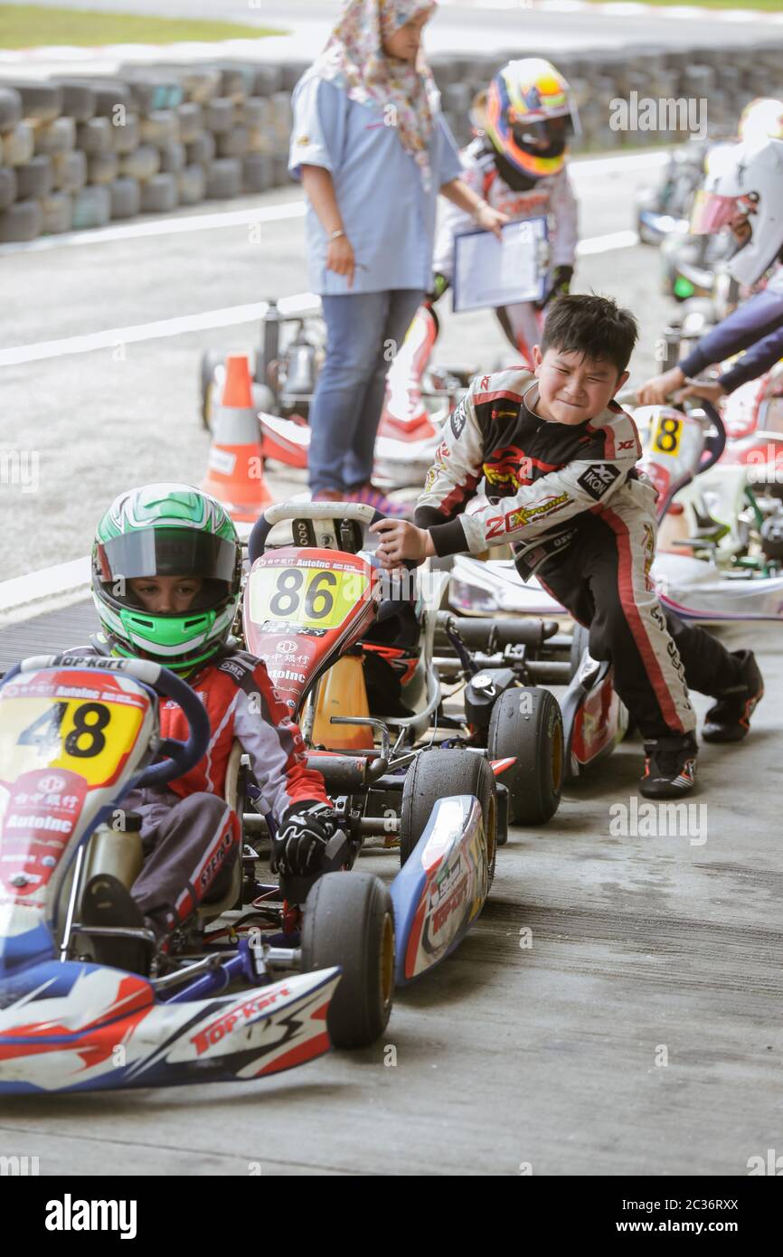 Kart racers getting ready for routine checkout procedure after a race ...