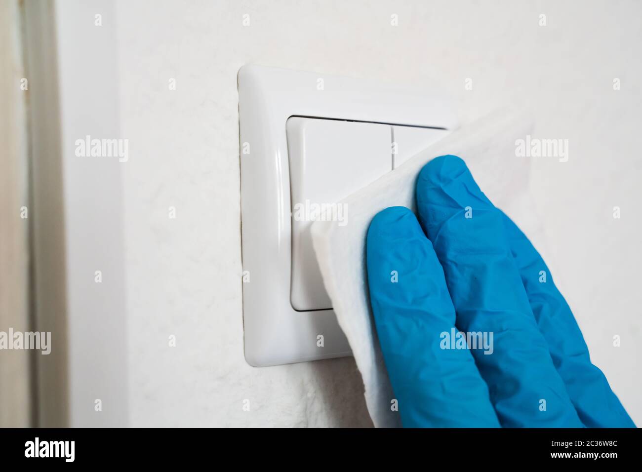 Man Wiping Light Switch With Sanitizer Against Virus Infection Stock ...