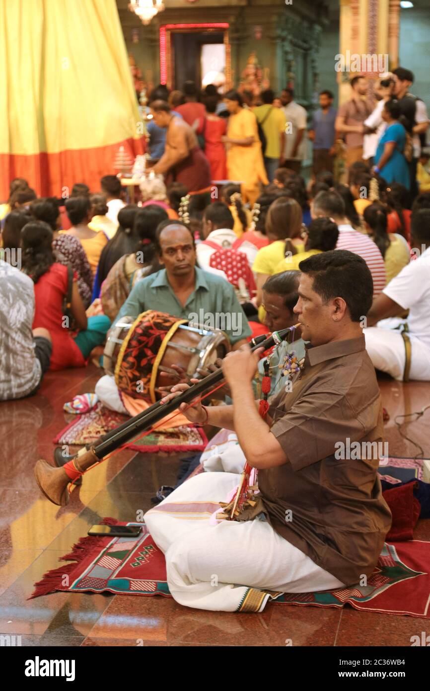 Temple musicians playing melody using shehnai and drum during Thaipusam ...