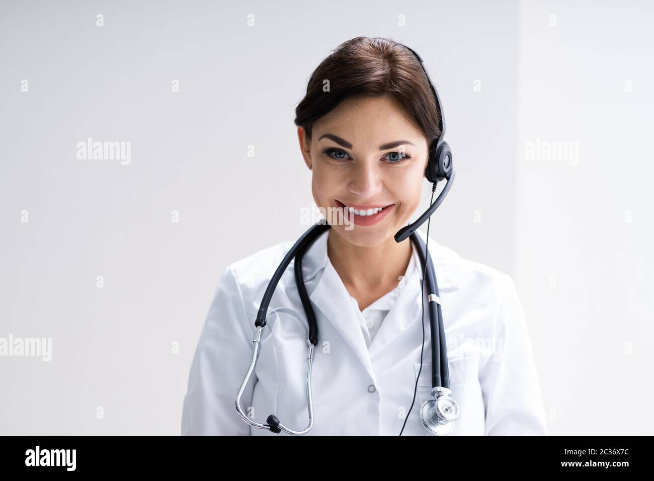 Happy Doctor Wearing Headset In Call Center Stock Photo - Alamy