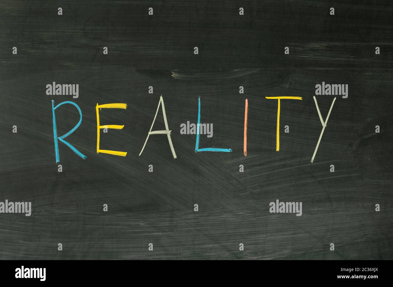 Reality word handwritten on the school blackboard Stock Photo - Alamy