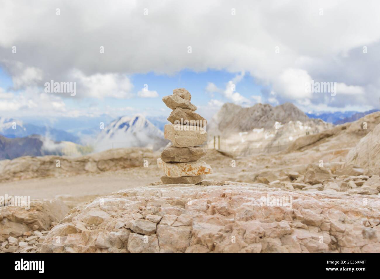Stones stack in mountain panorama with blue sky visualizes creativity ...