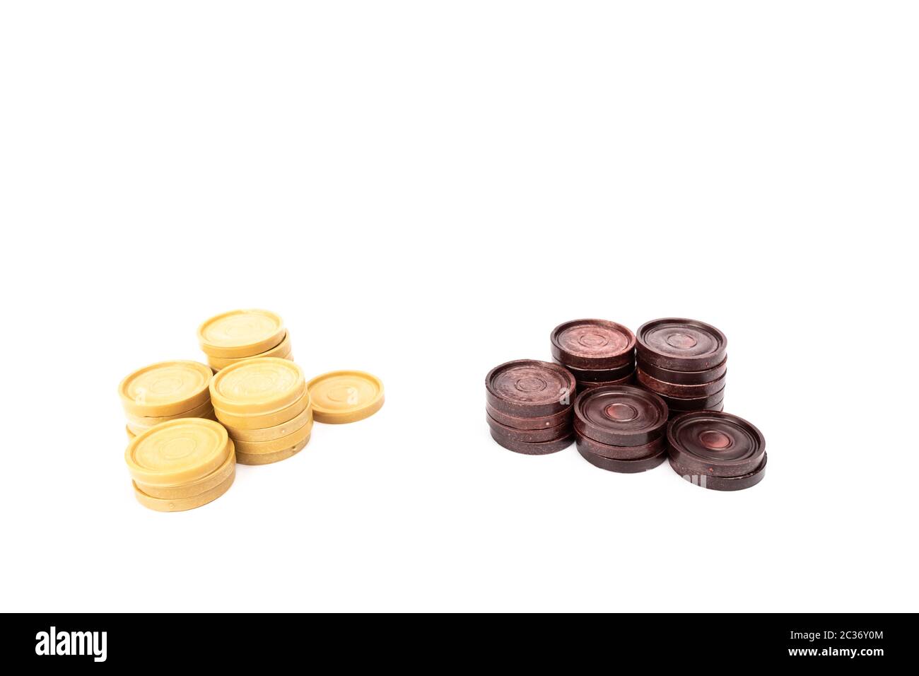 low-end plastic round checkers piece in white background in studio ...