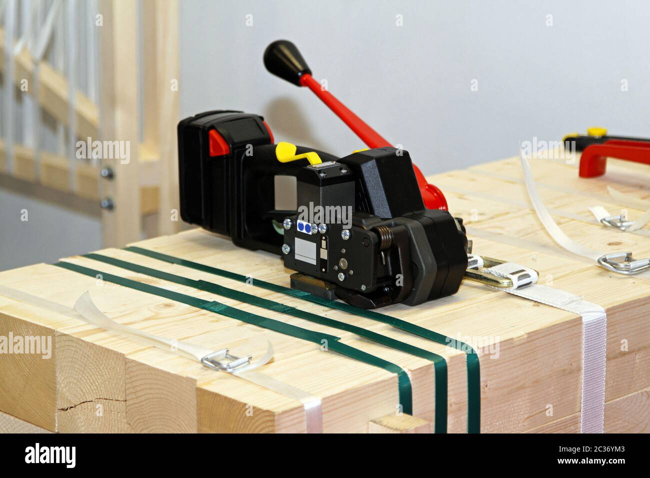 Portable strapping machine for packing crates and boxes Stock Photo - Alamy