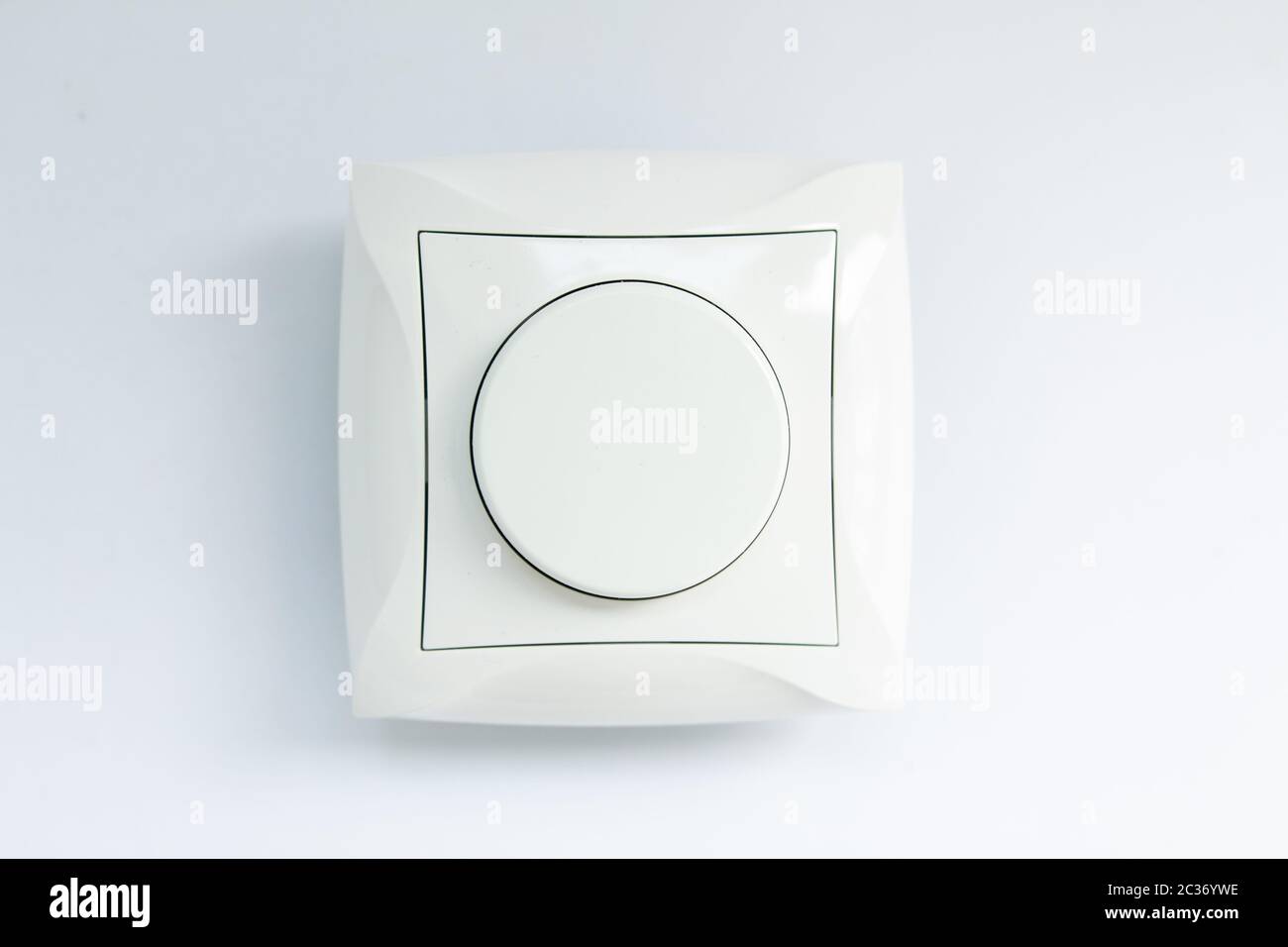 round light switch on white background Stock Photo - Alamy