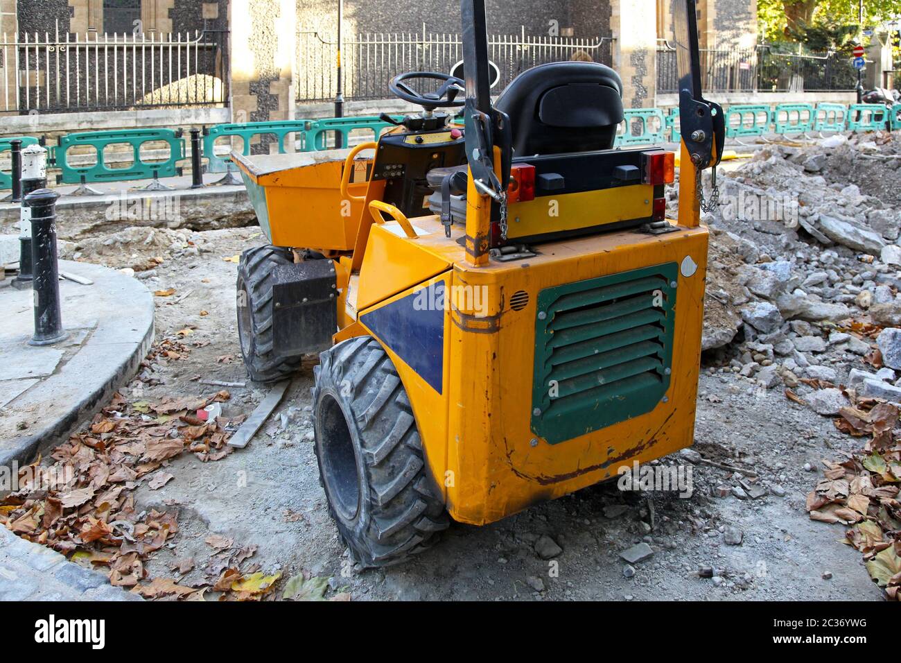 Dump truck with front bucket at construction site Stock Photo - Alamy