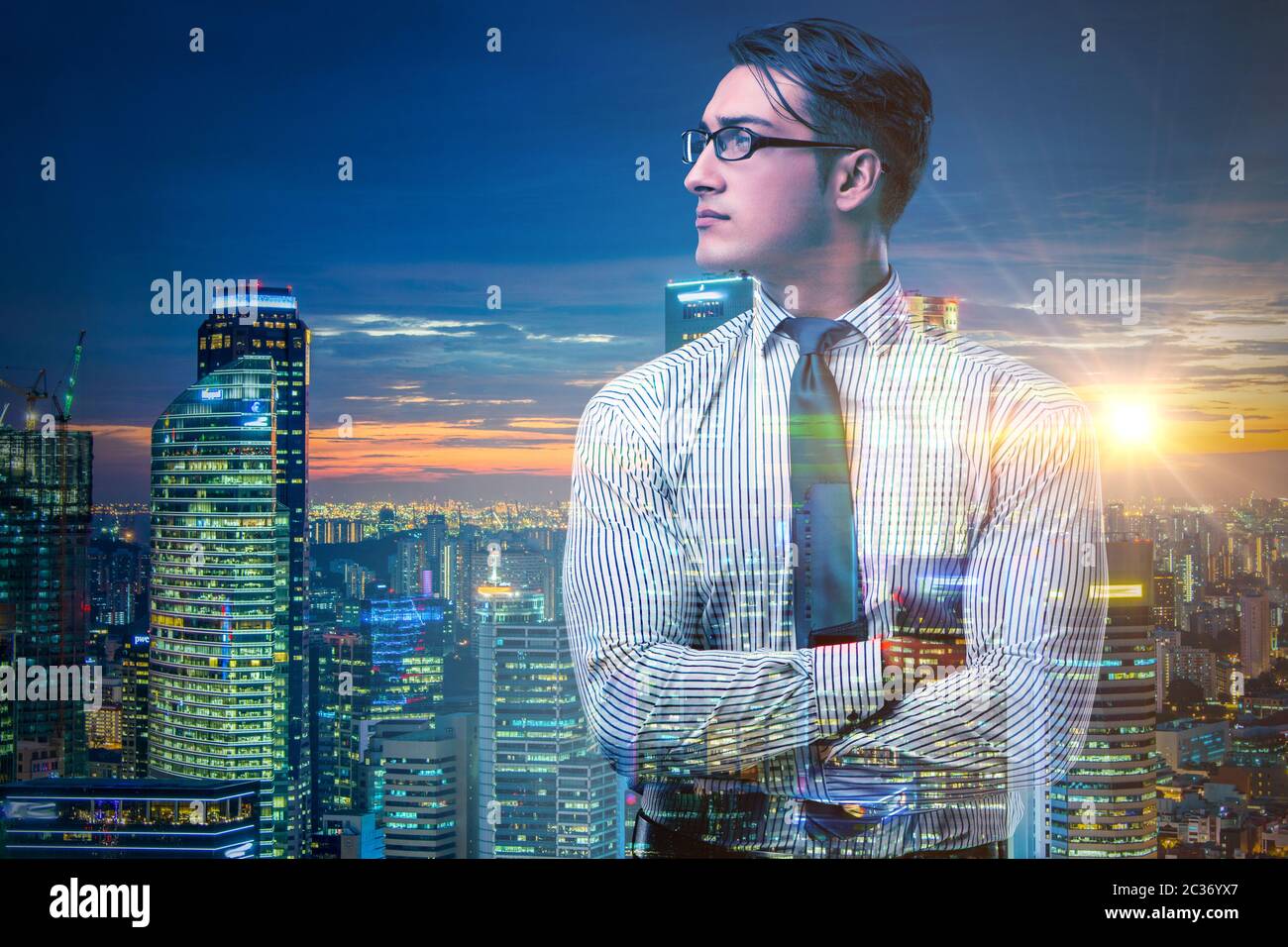 Successful businessman against cityscape in business concept Stock ...
